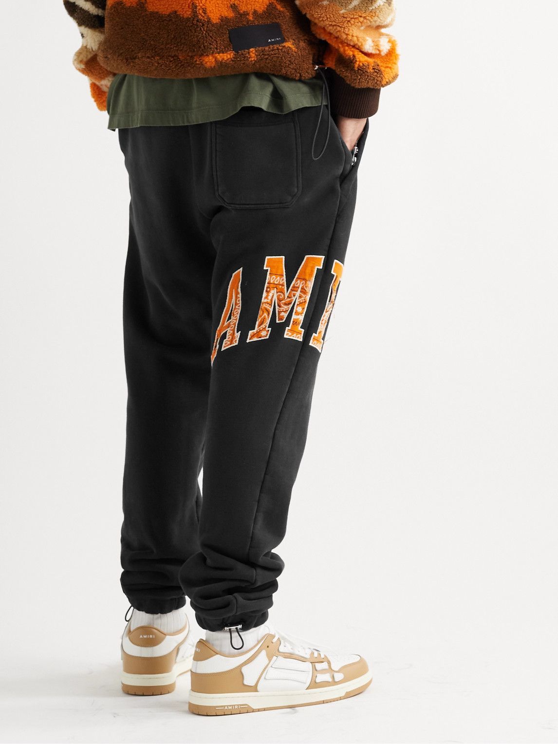 AMIRI - Slim-Fit Tapered Logo-Appliquéd Cotton-Jersey Sweatpants ...